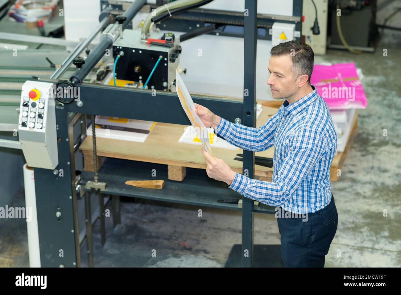 man in printing factory Stock Photo - Alamy