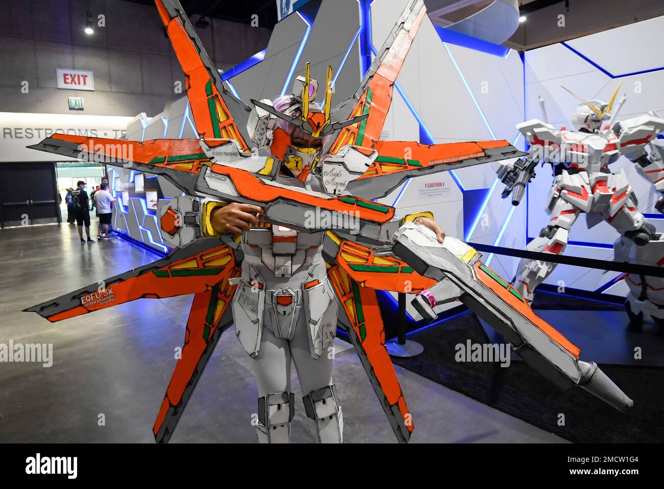 Jordan Olsen of Los Angeles poses in front of the Gundhan Base booth on ...