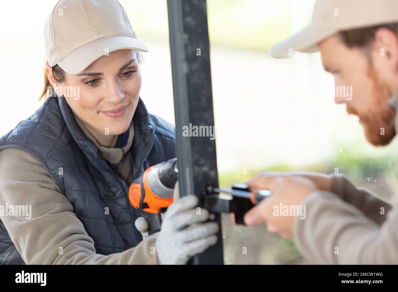 construction team standing against building Stock Photo - Alamy