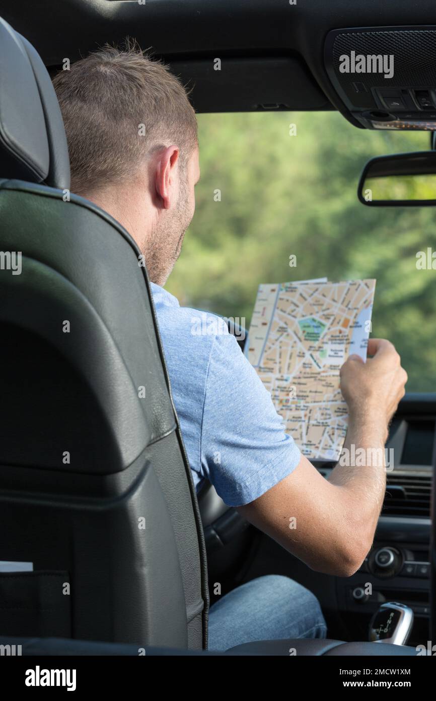 mature driver reading a map Stock Photo - Alamy