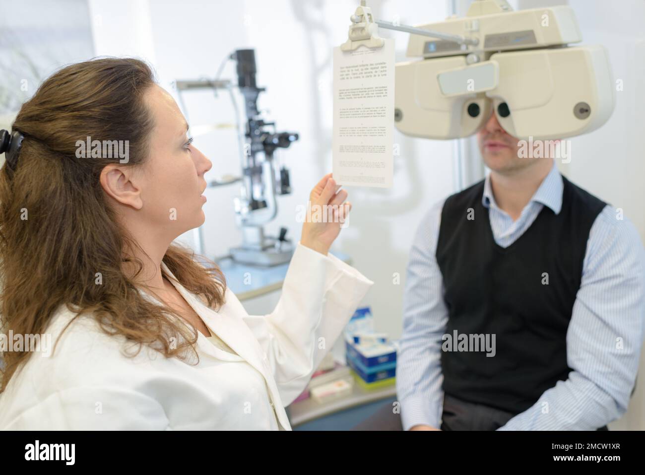 Reading during eyesight examination hi-res stock photography and images ...