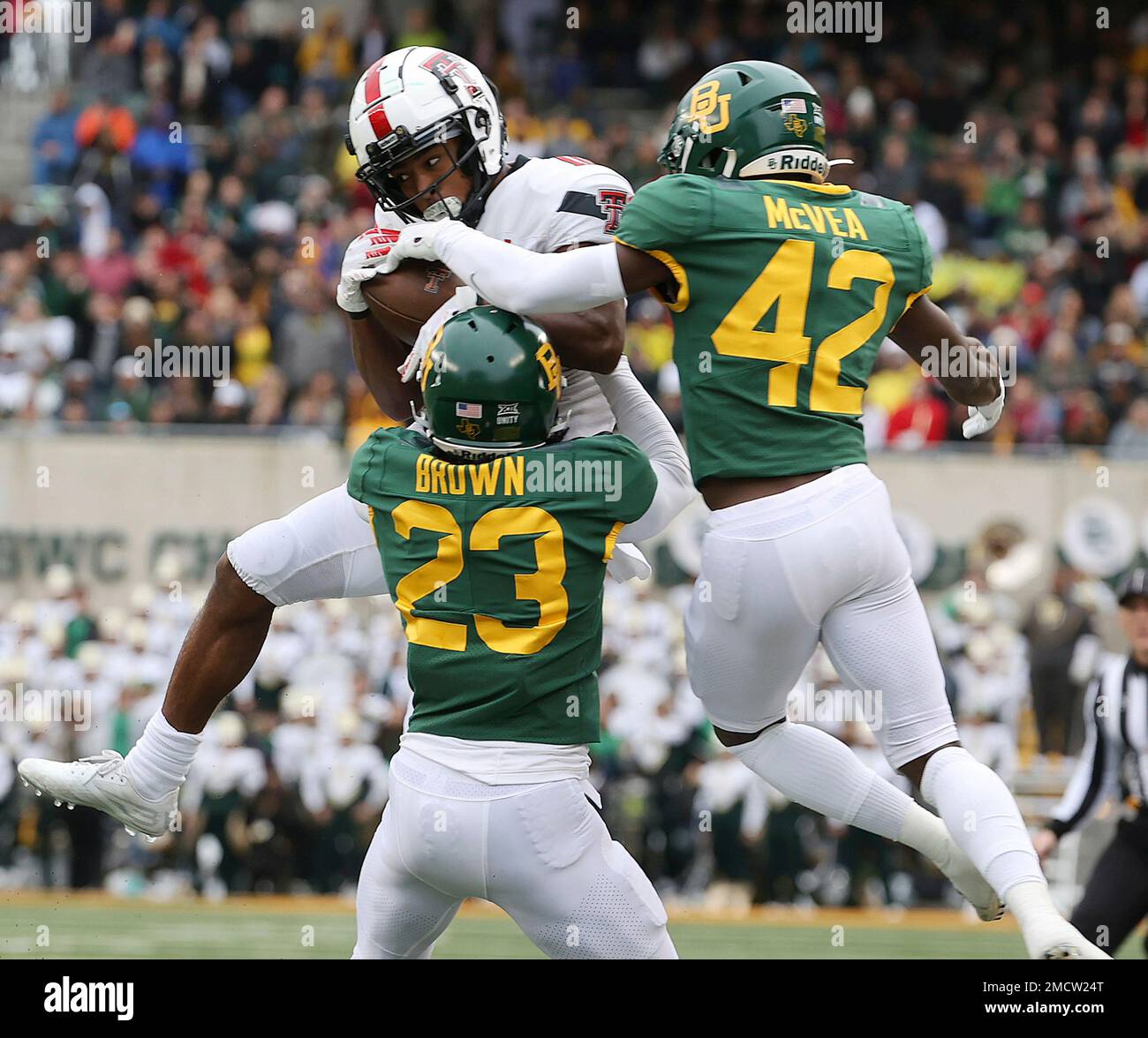 Texas Tech wide receiver Kaylon Geiger catches a pass between Baylor ...