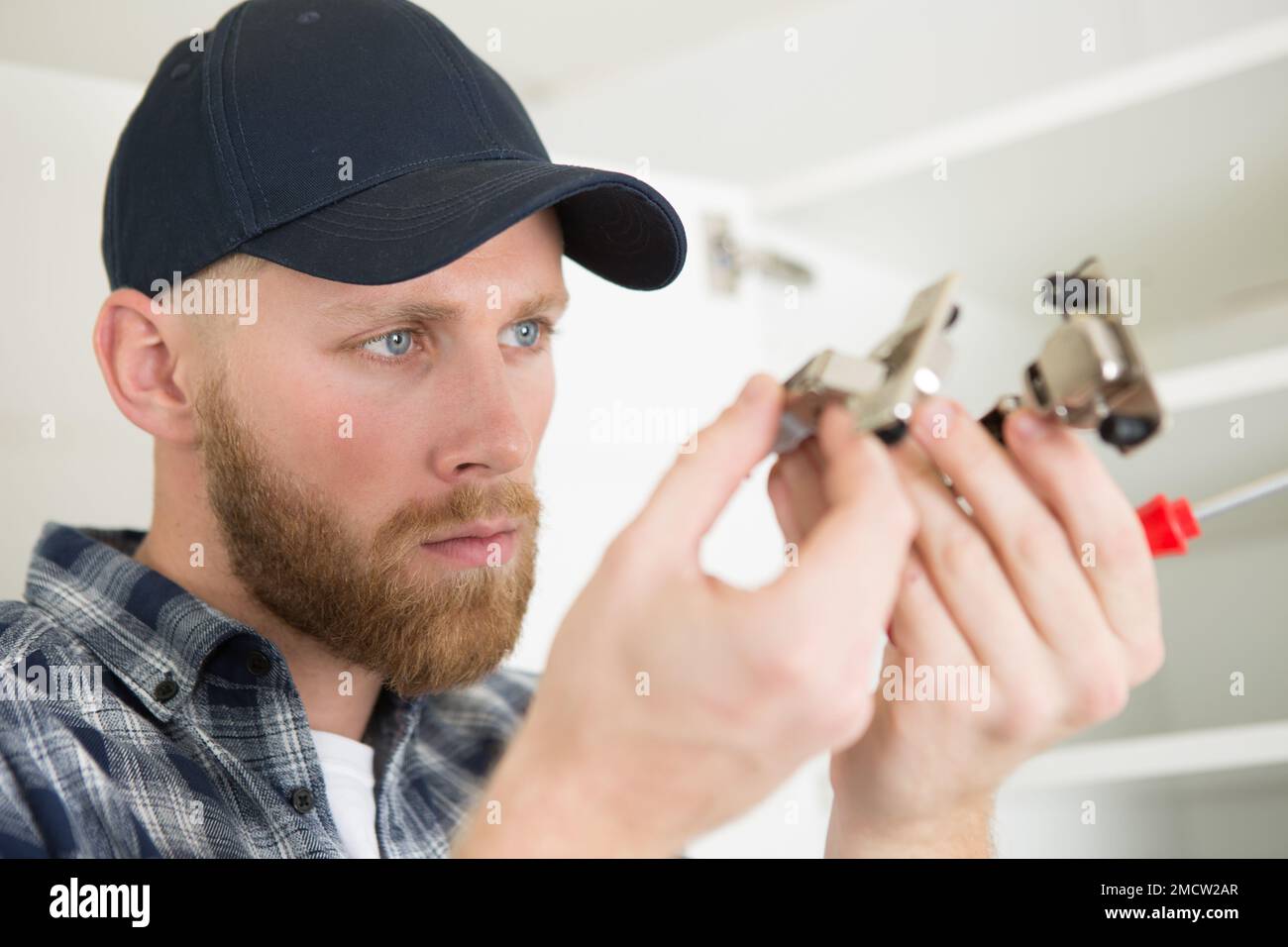 Worker putting wooden board hi-res stock photography and images - Alamy