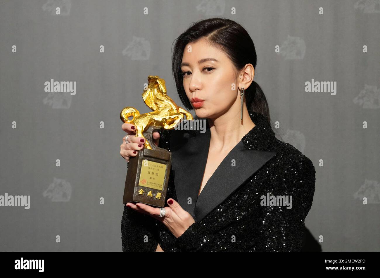 Taiwanese actress Alyssa Chia holds her award for Best Leading Actress ...