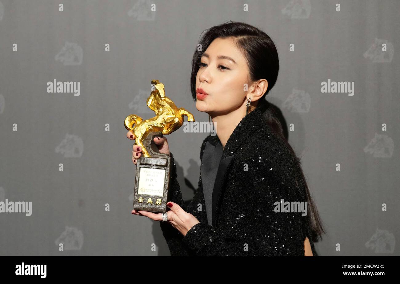 Taiwanese actress Alyssa Chia holds her award for Best Leading Actress ...