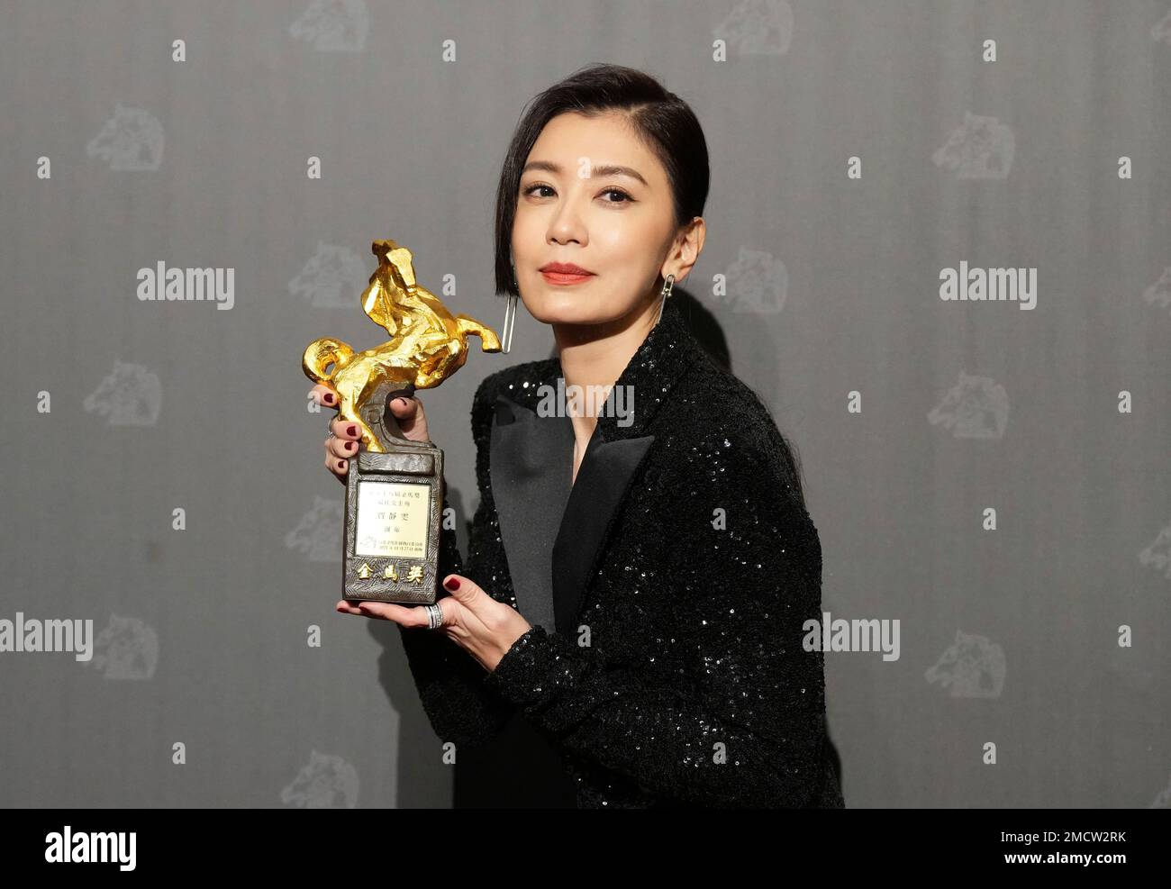 Taiwanese actress Alyssa Chia holds her award for Best Leading Actress ...