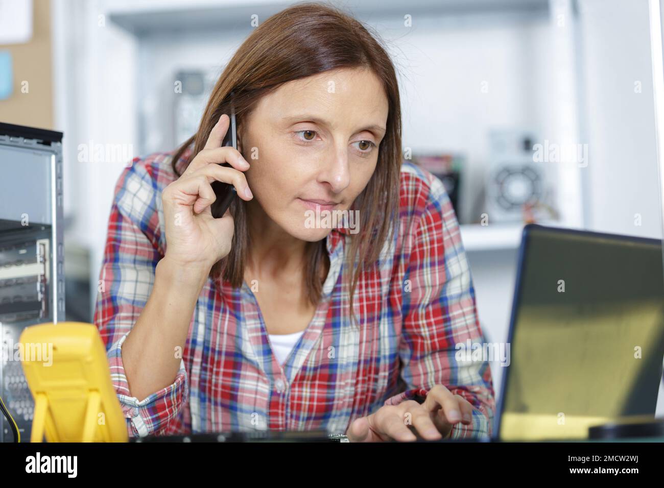 beautiful technical support checking a computer Stock Photo - Alamy