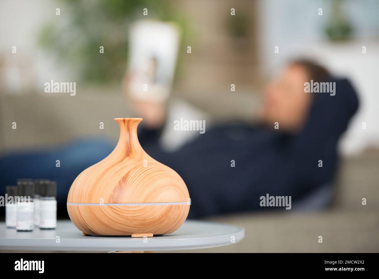 aroma oil diffuser on table in room Stock Photo - Alamy