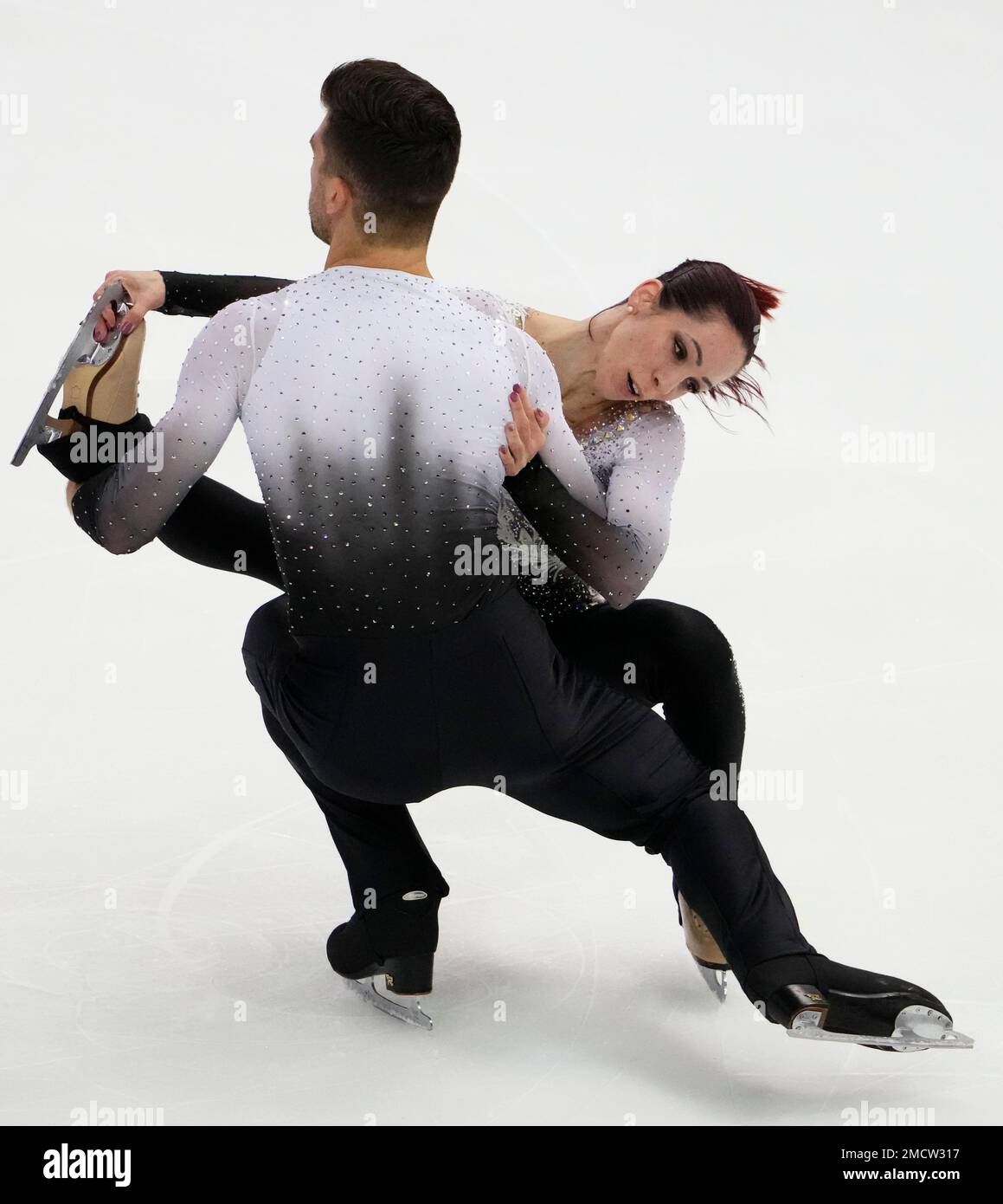 Italy's Nicole Bella Monica and Matteo Guarise perform their pairs free ...
