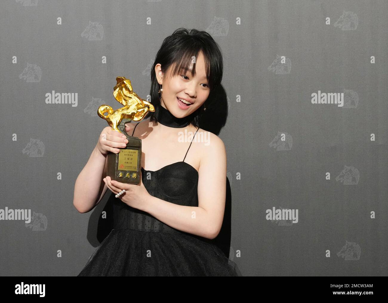 Taiwanese actress Caitlin Fang holds her award for Best New Performer ...