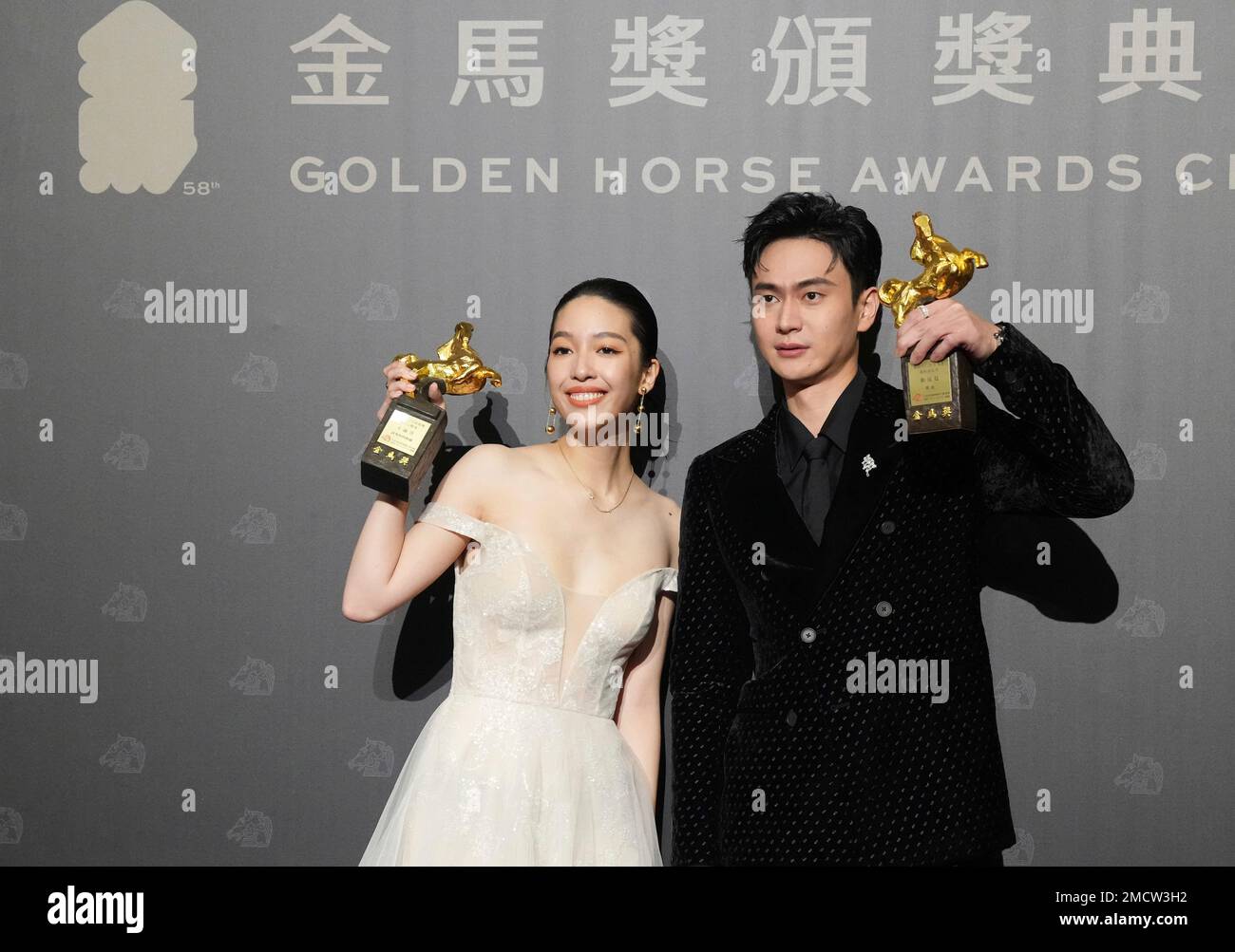 Taiwanese actress Wang Yu-xuan, left, and Liu Kuan-ting hold their ...