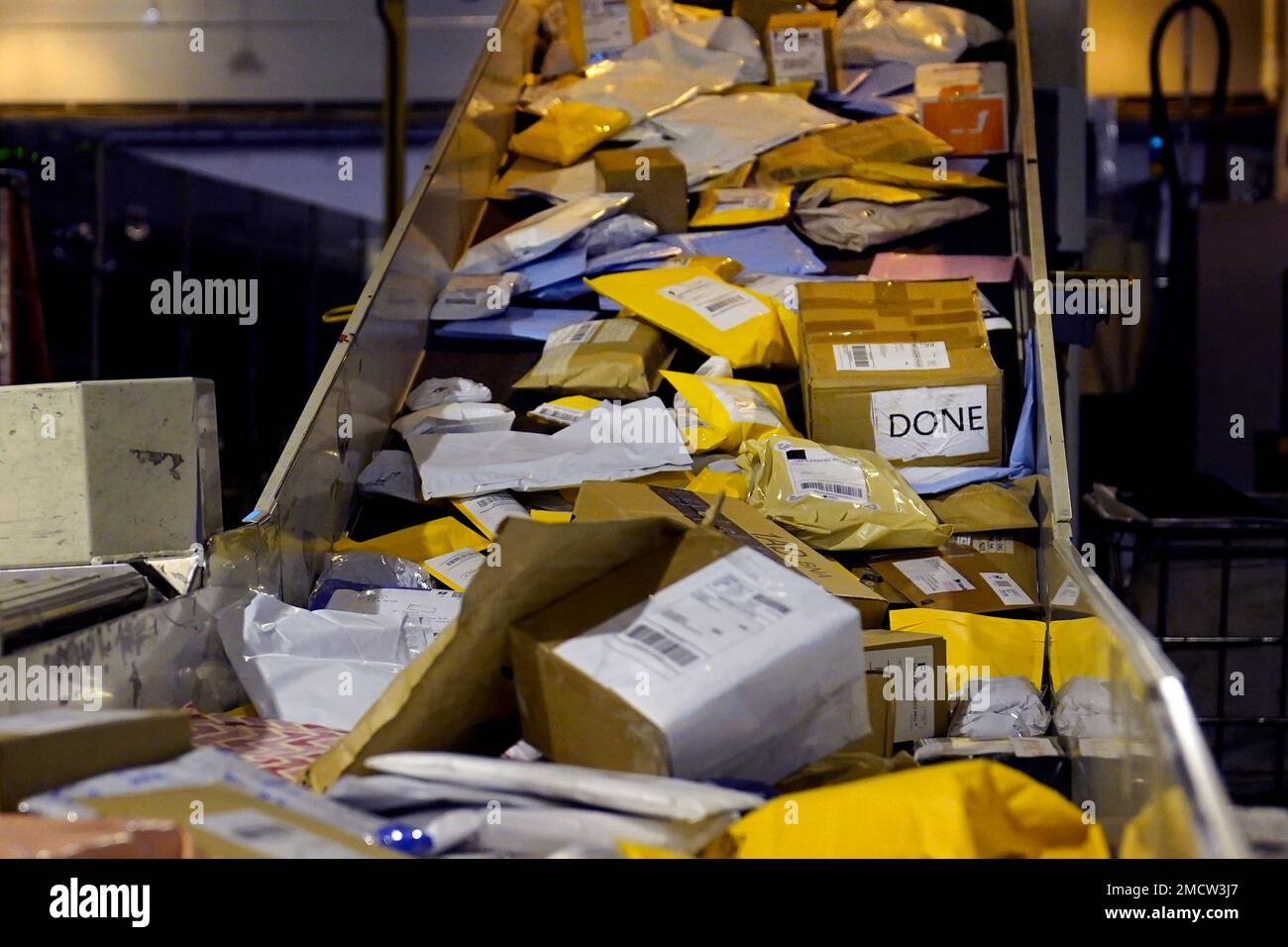 Parcels jam a conveyor belt at the United States Postal Service sorting ...