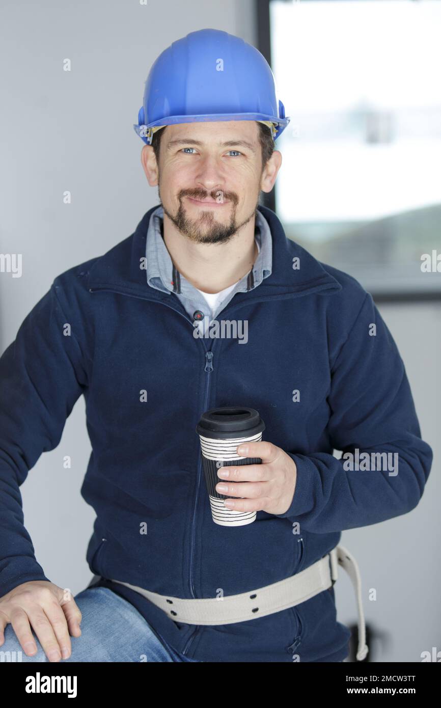 a construction worker enjoying coffee Stock Photo - Alamy