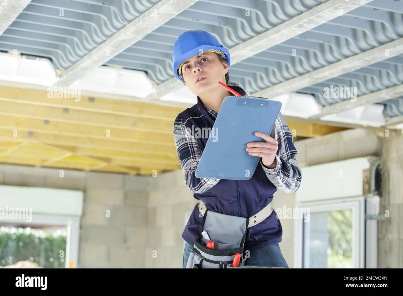 female construction engineer inspecting construction site Stock Photo ...