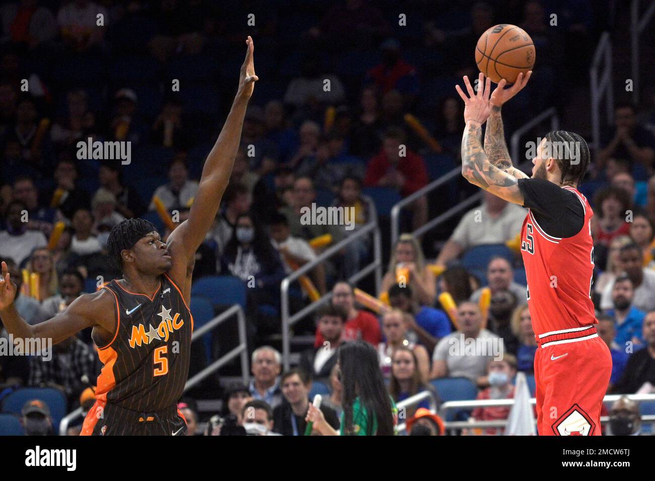 Chicago Bulls guard Lonzo Ball, right, shoots a three-point basket in ...