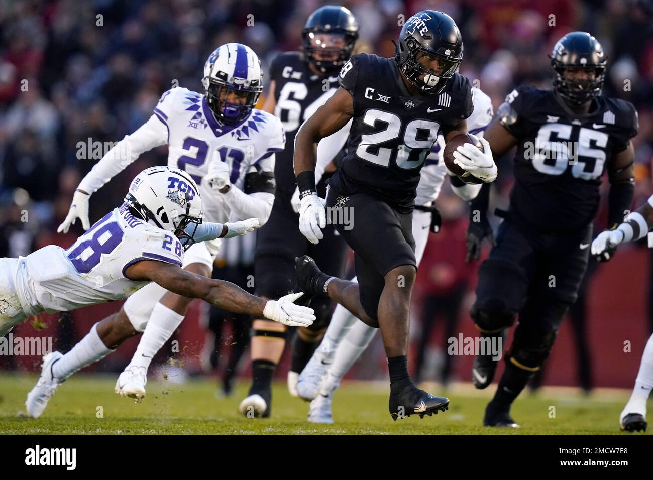 Iowa State running back Breece Hall runs from TCU safety Nook Bradford ...