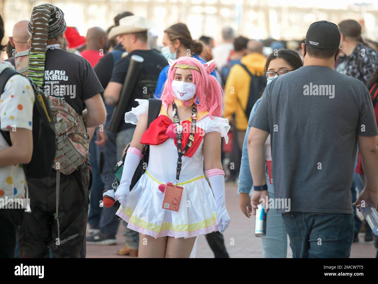 Fans walk in front of the convention center on day one of Comic-Con ...
