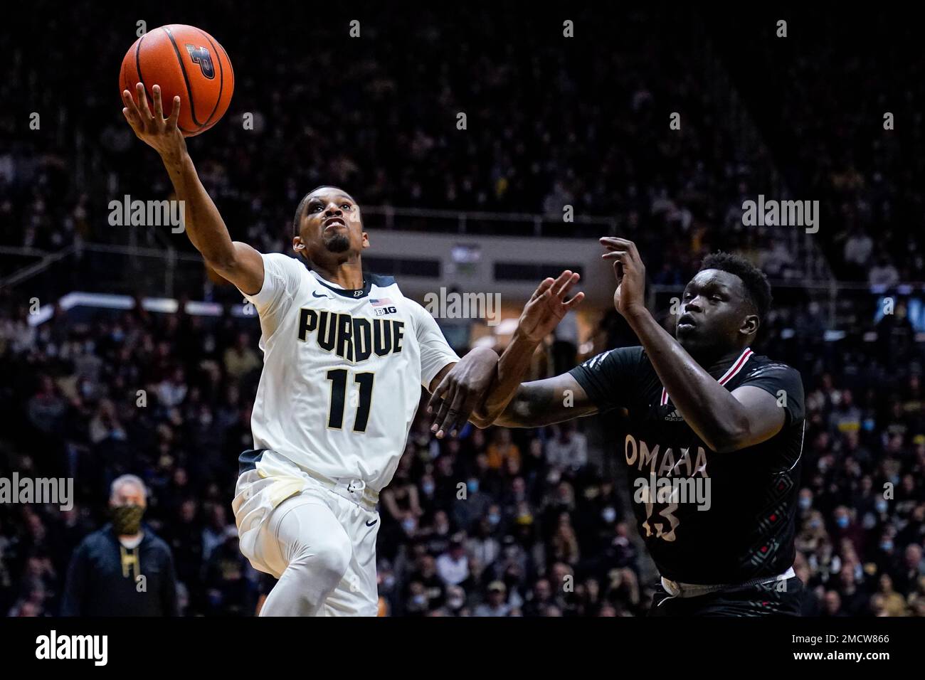 Purdue's Isaiah Thompson (11) shoots over Omaha's Wanjang Tut (13 ...
