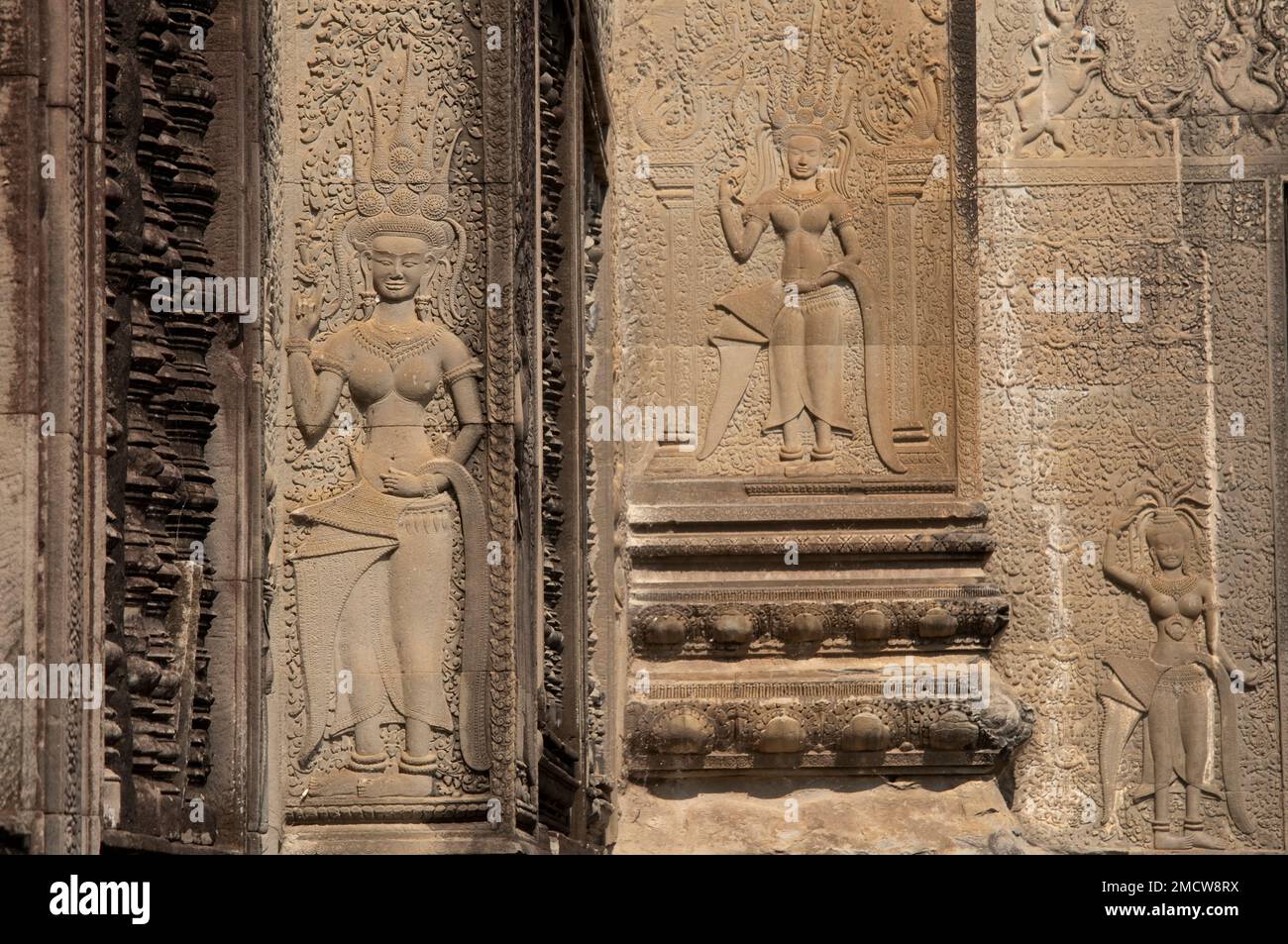 Carvings of trio of Apsaras in wall, Angkor Wat temple, Siem Riep ...