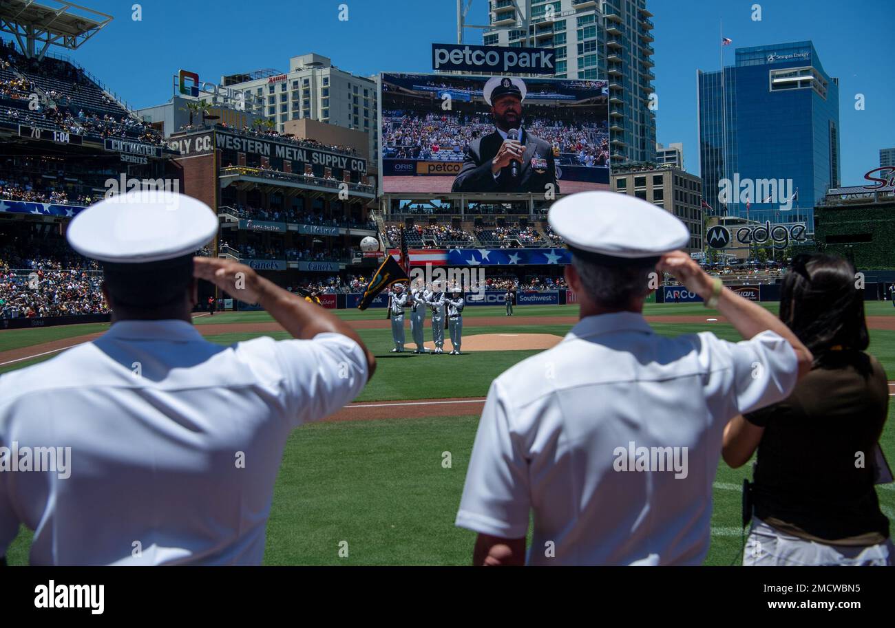SAN DIEGO – Members of Naval Special Warfare salute the American flag ...