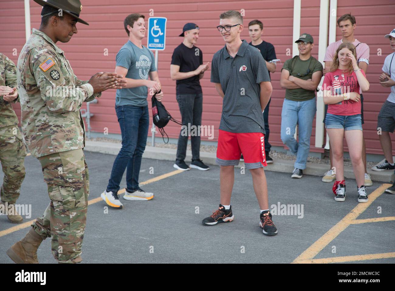 Sgt. 1st Class Chris Sehy, U.S. Army drill sergeant, applauds the winner of “Sergeant Says,” as ...