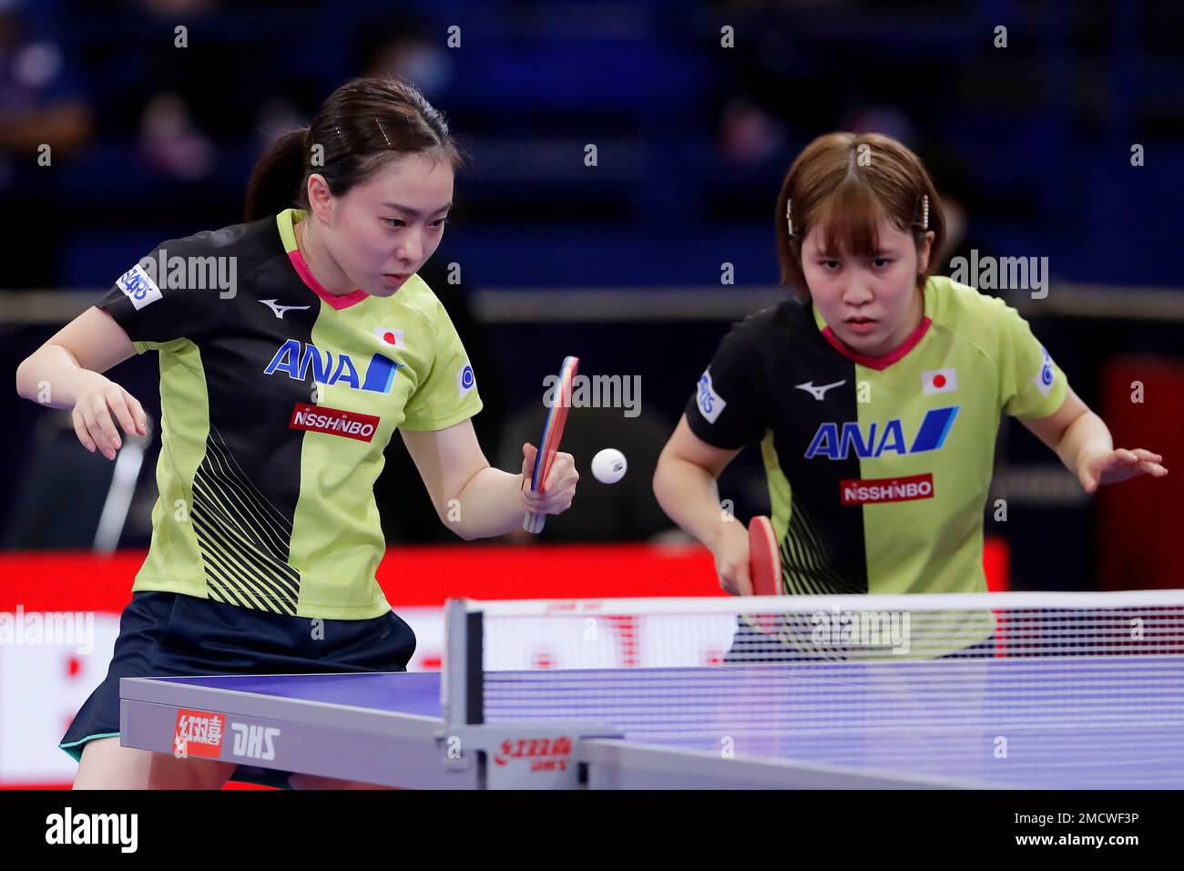 Japan's Kasumi Ishikawa, left, returns a volley as teammate Miu Hirano ...