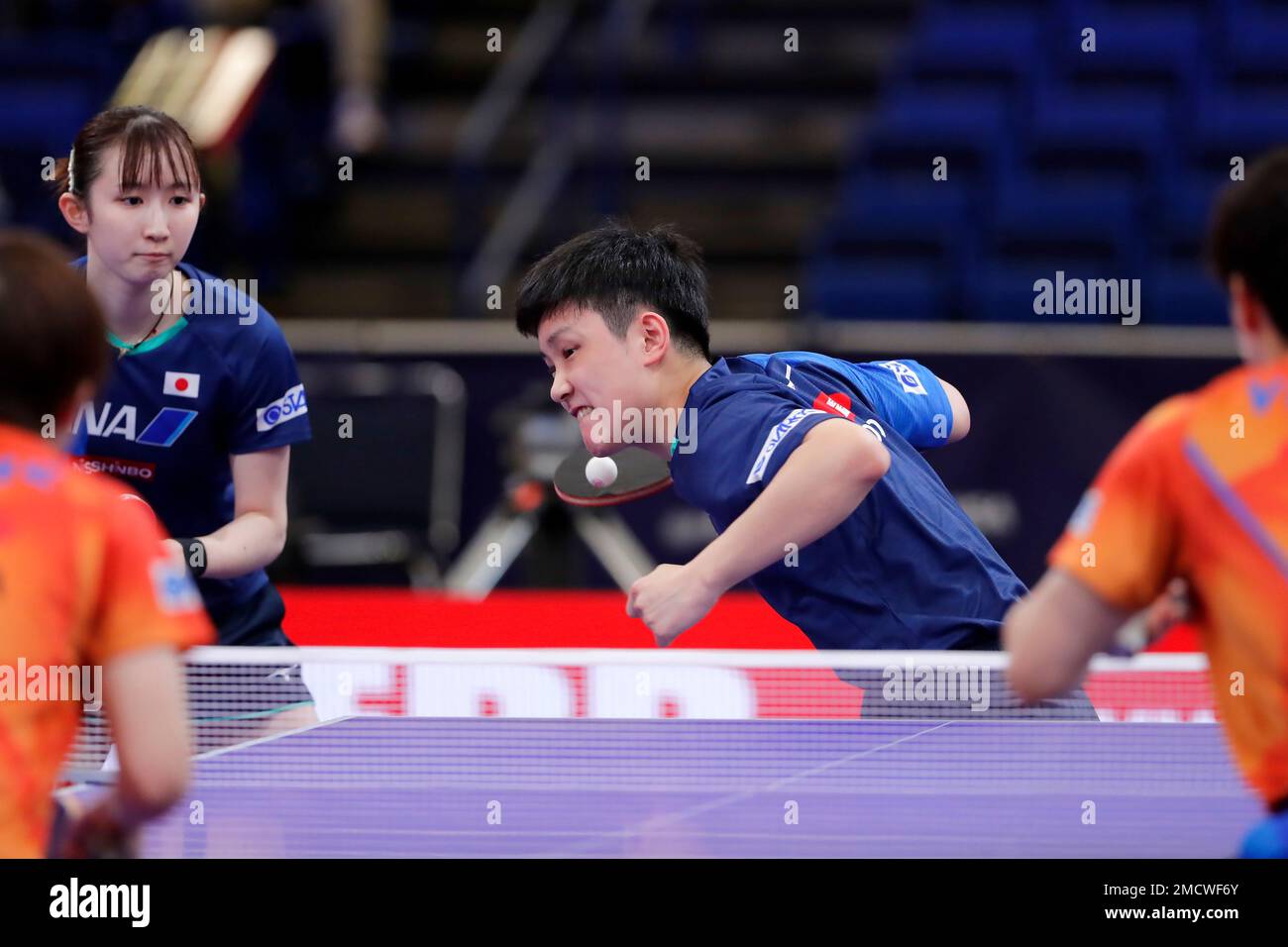 Japan's Hina Hayata, left, looks on as teammate Tomokazy Harimoto ...