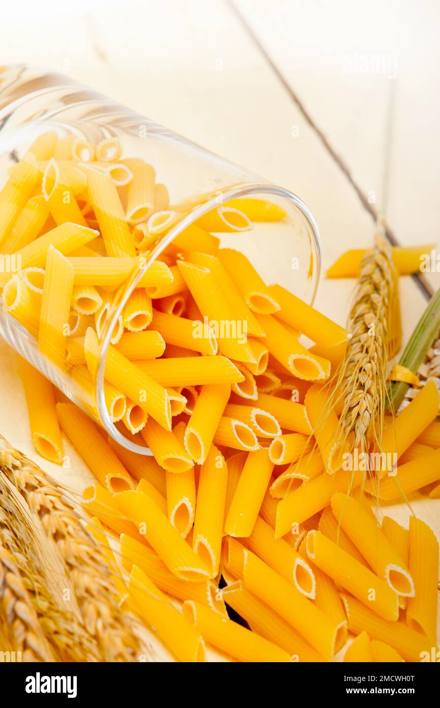 Short Italian pasta penne with durum wheat grains Stock Photo - Alamy