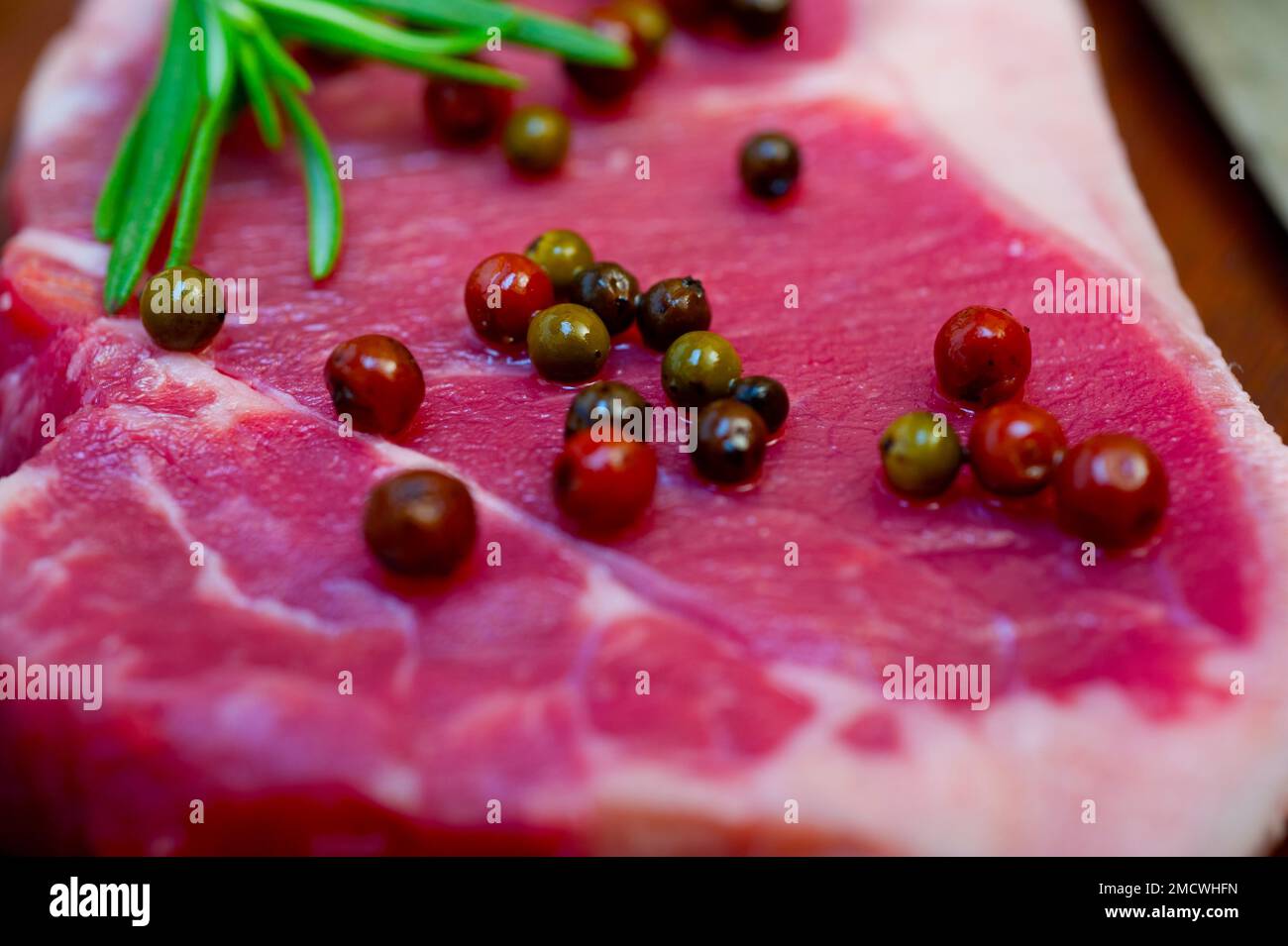 Raw uncooked ribeye beef steak butcher selection Stock Photo - Alamy