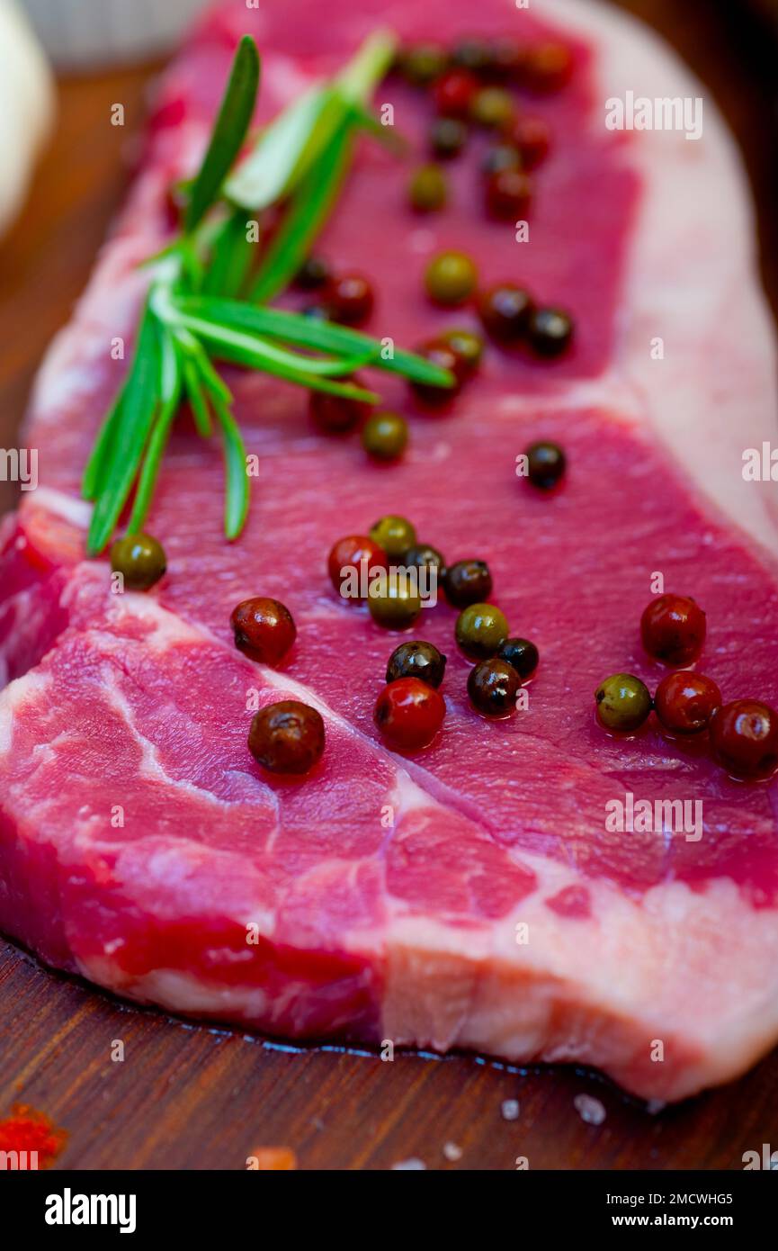 Raw uncooked ribeye beef steak butcher selection Stock Photo - Alamy