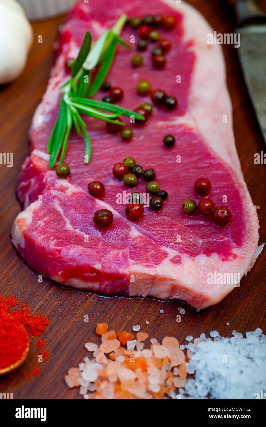 Raw uncooked ribeye beef steak butcher selection Stock Photo - Alamy