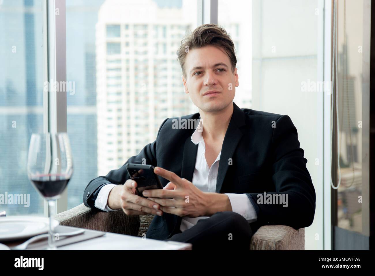 Young businessman sitting and waiting someone for meet in the ...