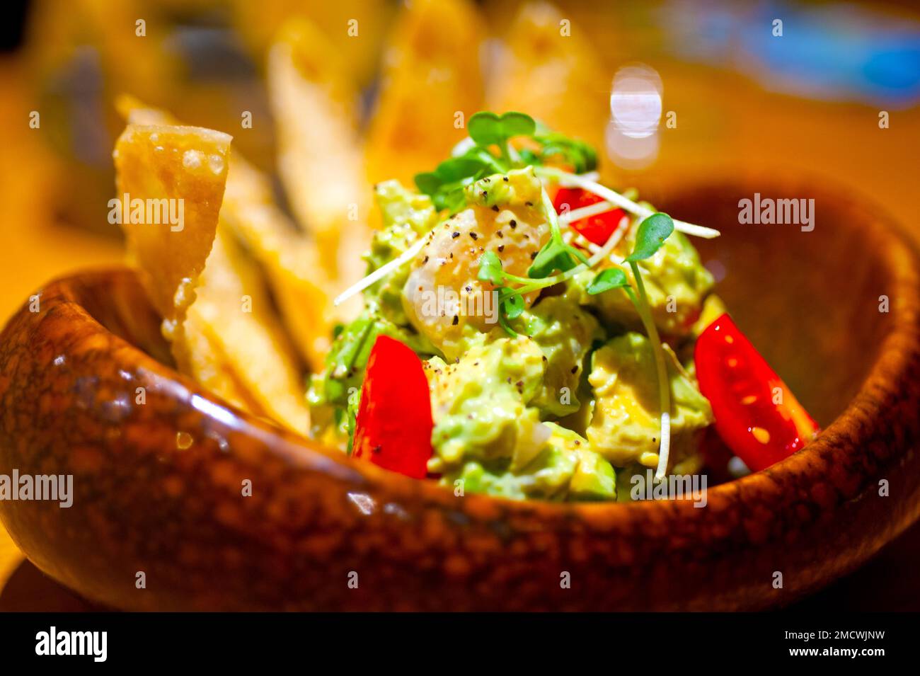 Fresh avocado and shrimps salad with nachos on side Stock Photo - Alamy