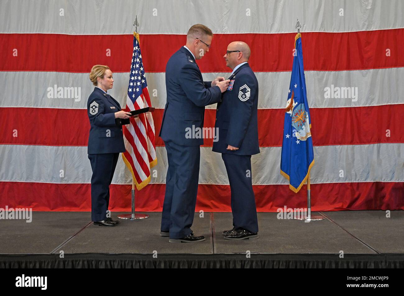 Col. Matthew Fritz, 419th Fighter Wing commander, pins a Bronze Star ...