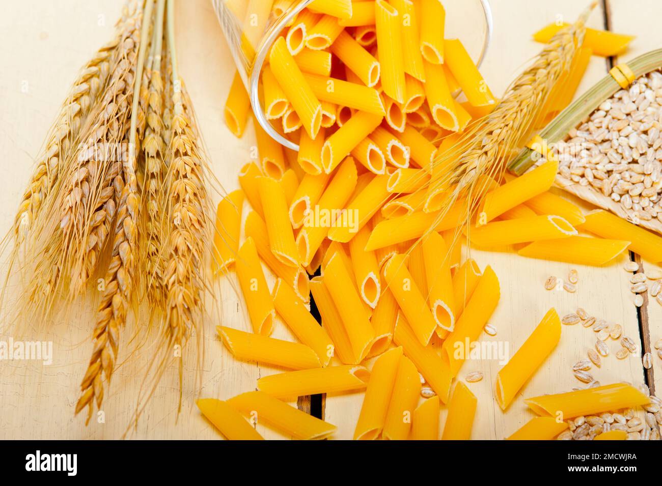 Short Italian pasta penne with durum wheat grains Stock Photo - Alamy
