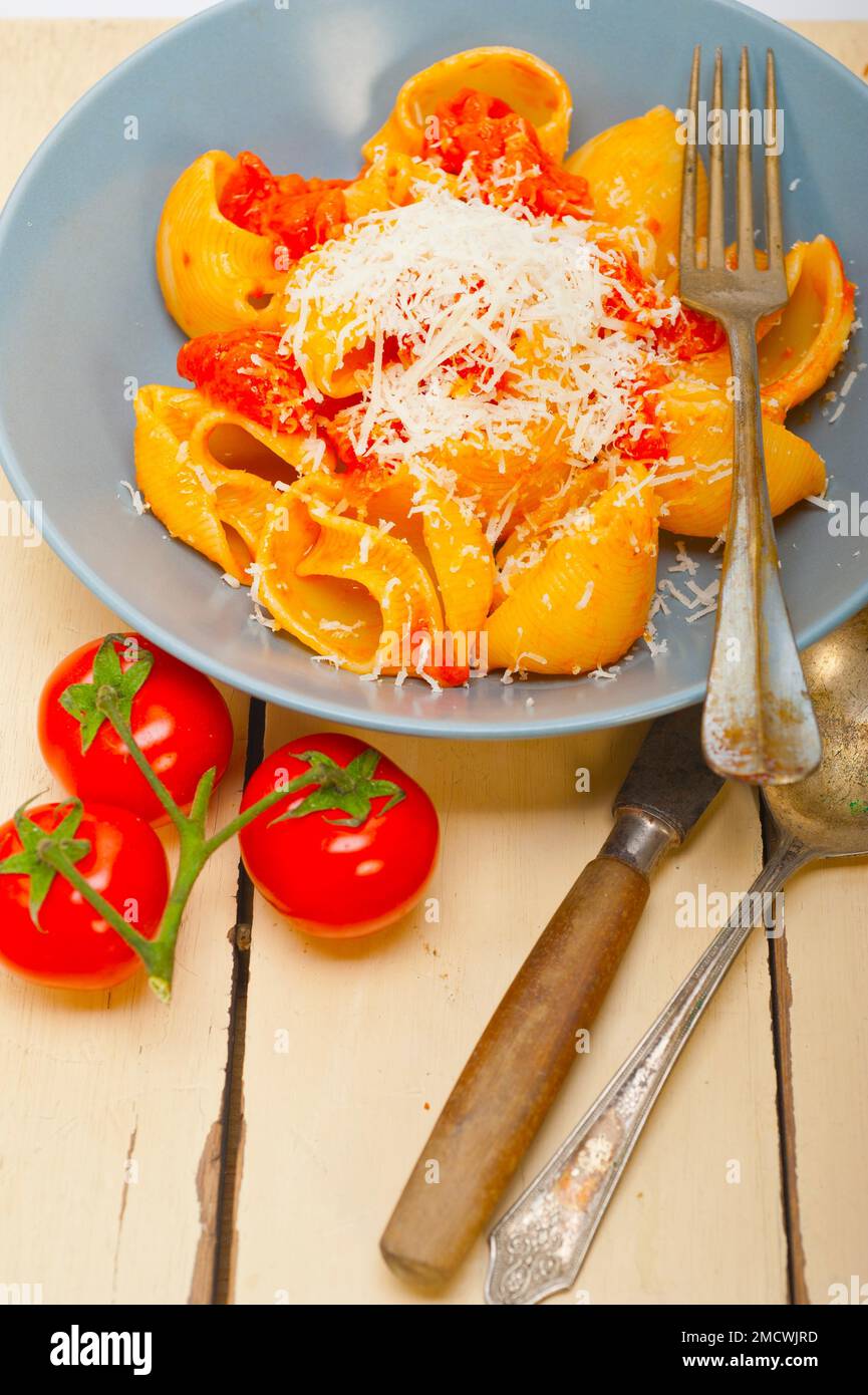 Italian snail lumaconi pasta with ripe cherry tomatoes sauce ...