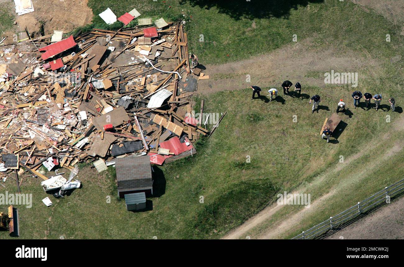 FILE - In this May 24, 2006, file photo, workers, including Federal ...