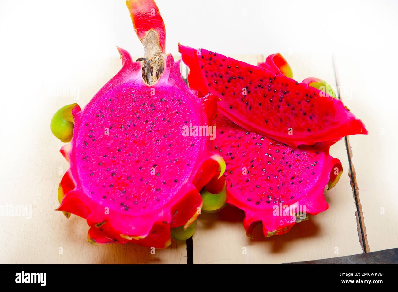 Fresh thai purple dragon fruit over white rustic table Stock Photo - Alamy