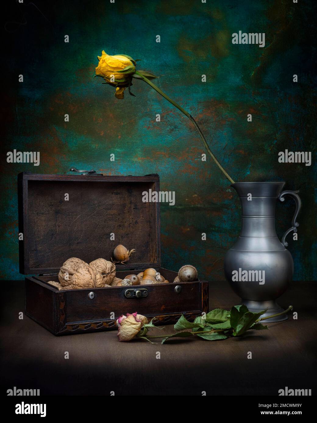Theme of life and death, still life with nuts in old wooden box next to ...
