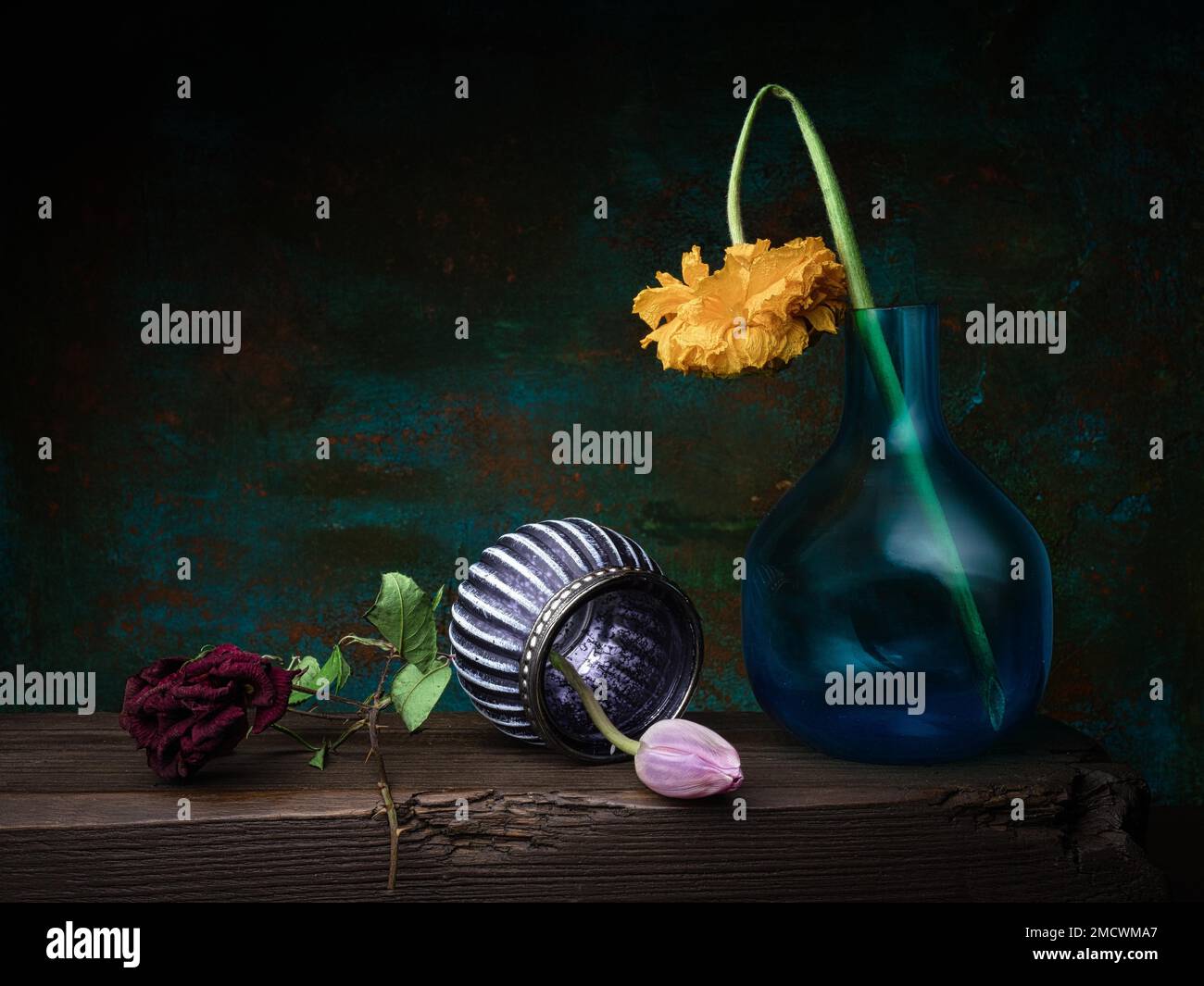 Theme Life and Death, Yellow dried flower in glass vase next to ...