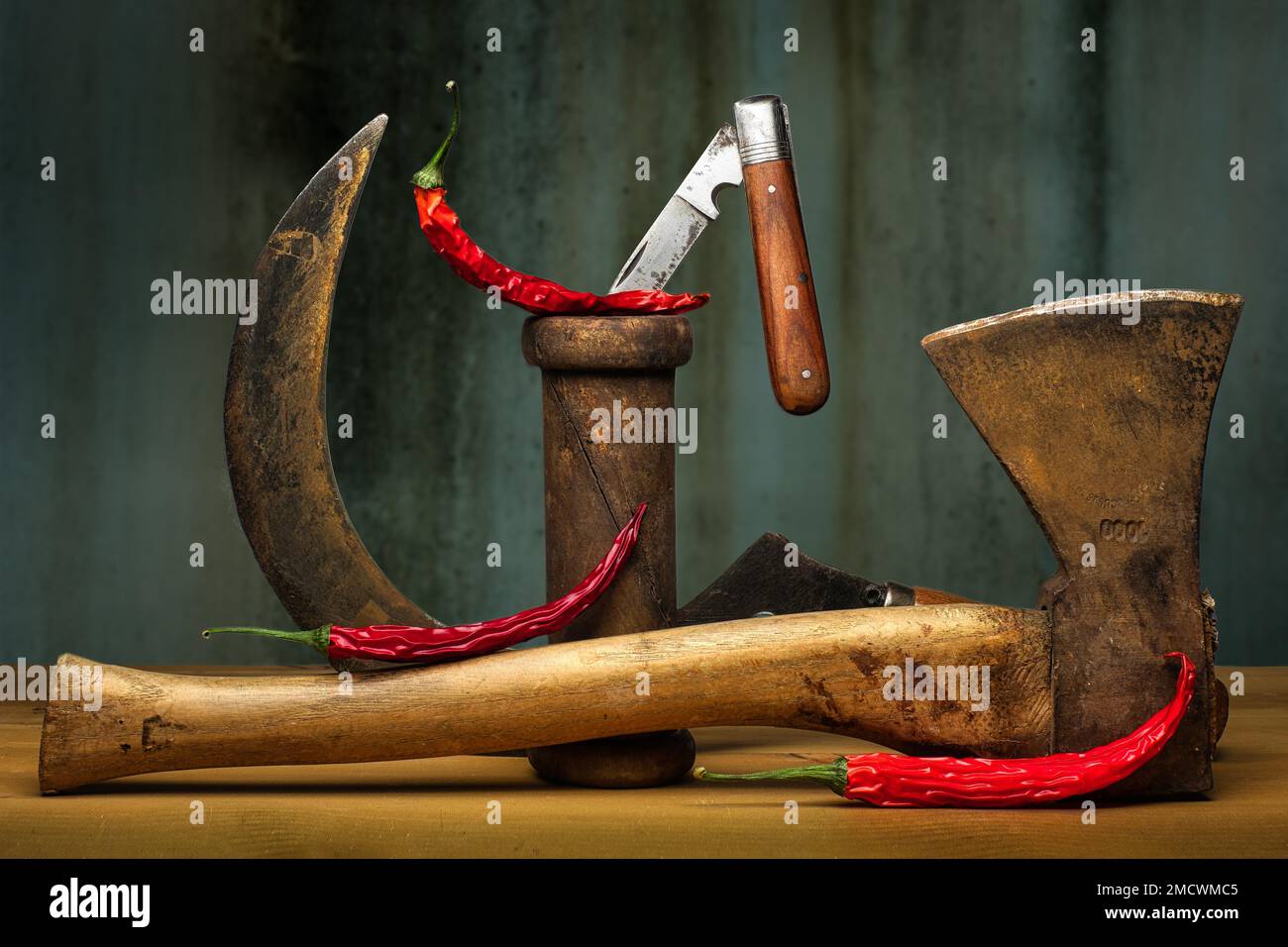 Food photography, still life with axe, sickle, pocket knife and red ...