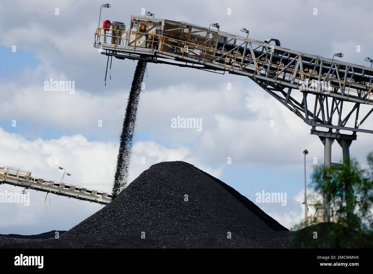 Coal Is poured onto a stack near Muswellbrook in the Hunter Valley ...