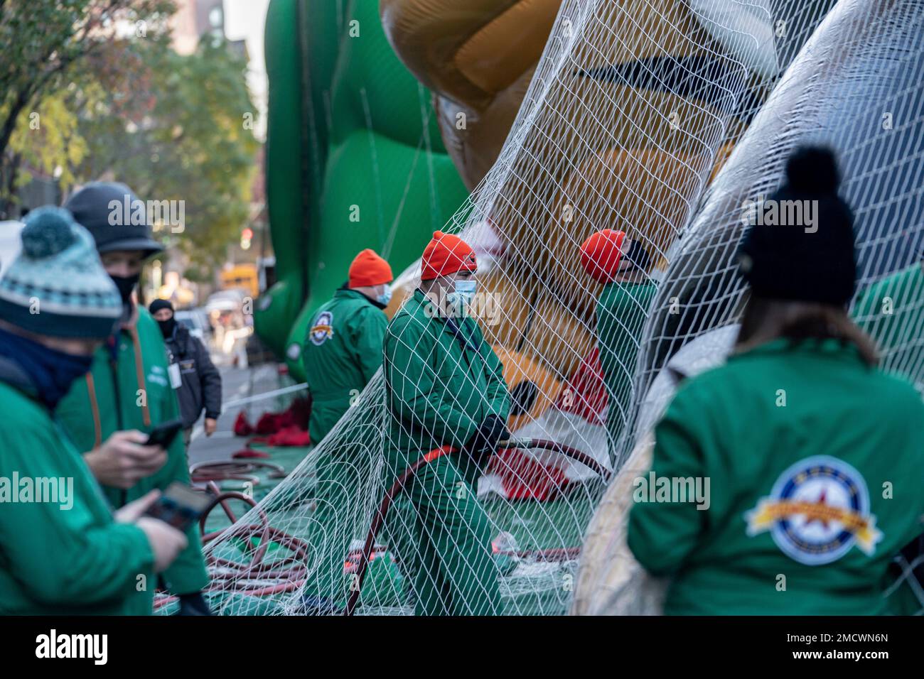 Inflation team members inflate the Boss baby balloon during Macy's 95th ...