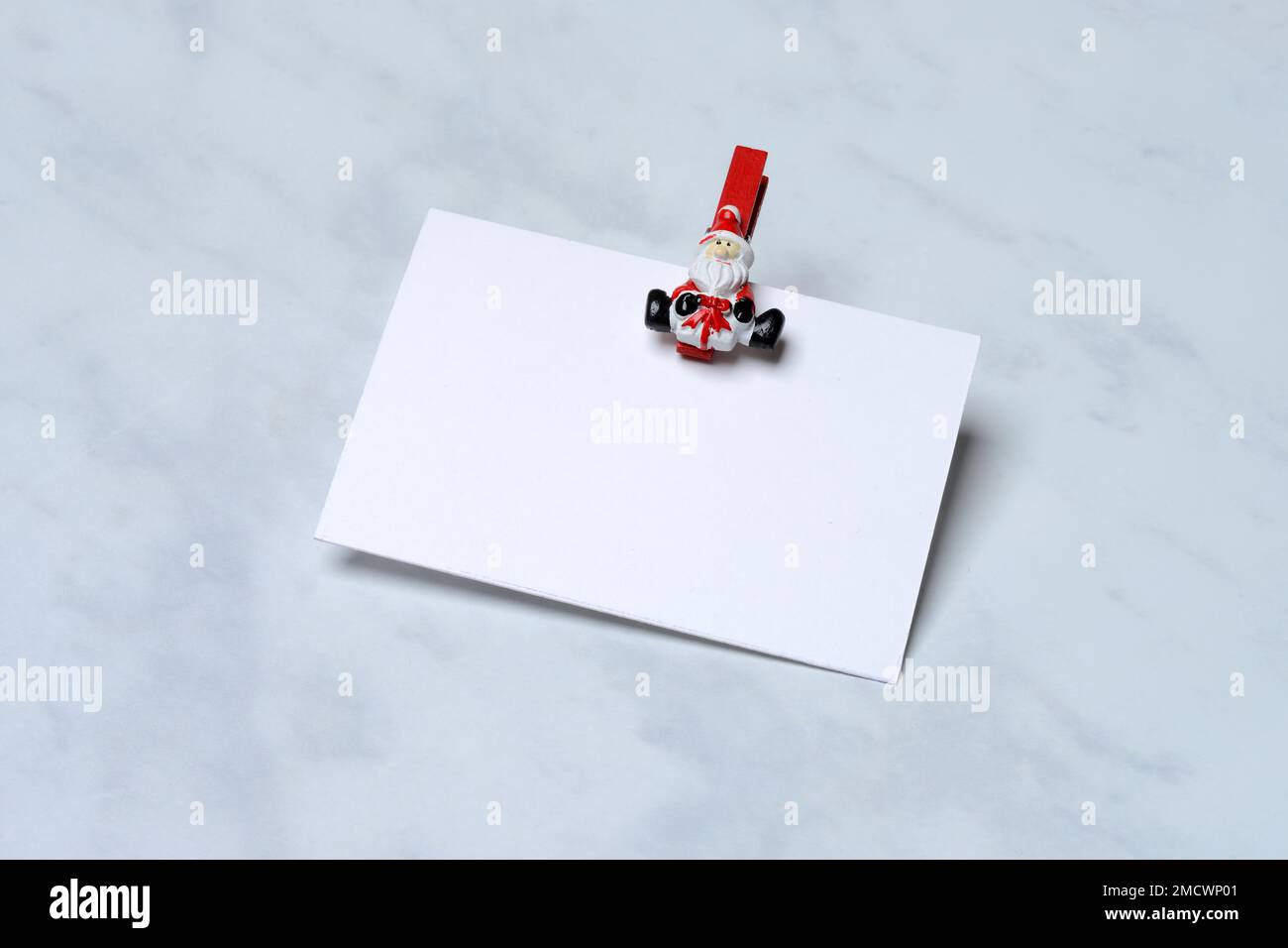 Christmas clip holds cardboard piece, Christmas Stock Photo - Alamy