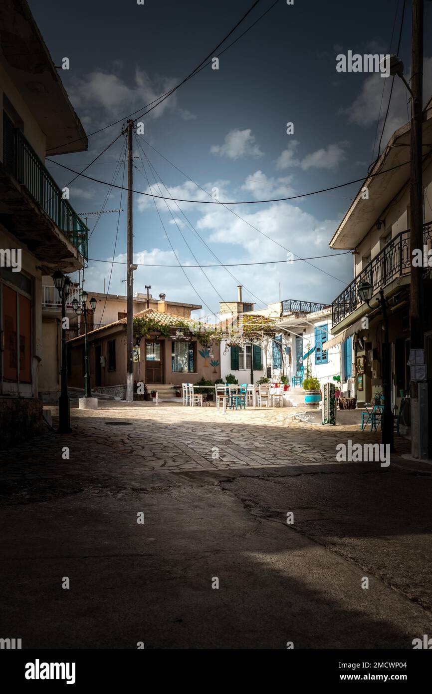 Market square with small Greek buildings and restaurants in the ...
