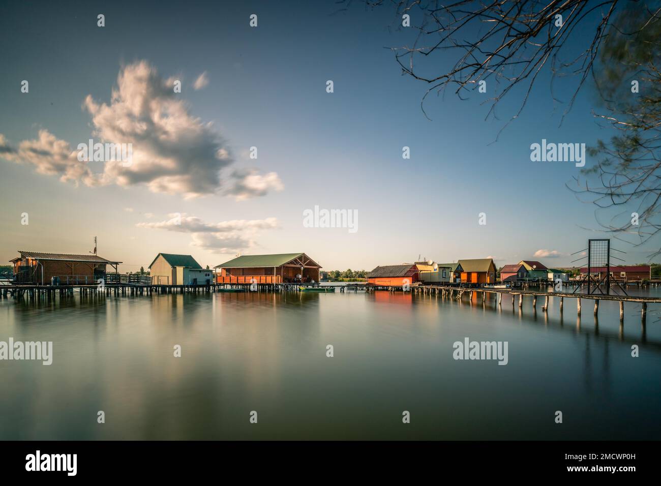 Small wooden houses with a jetty in a lake, they serve as fishing and ...