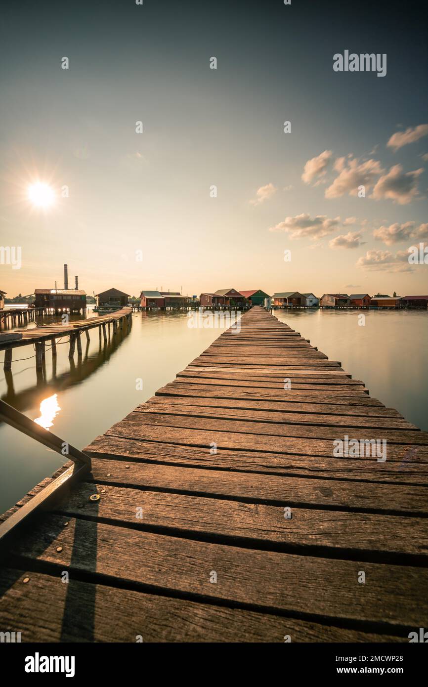 Small wooden houses with a jetty in a lake, they serve as fishing and ...