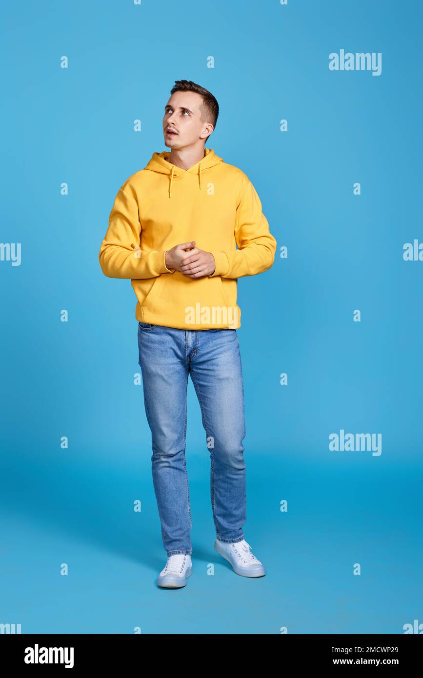 positive dreamy thoughtful young handsome man thinking Stock Photo - Alamy