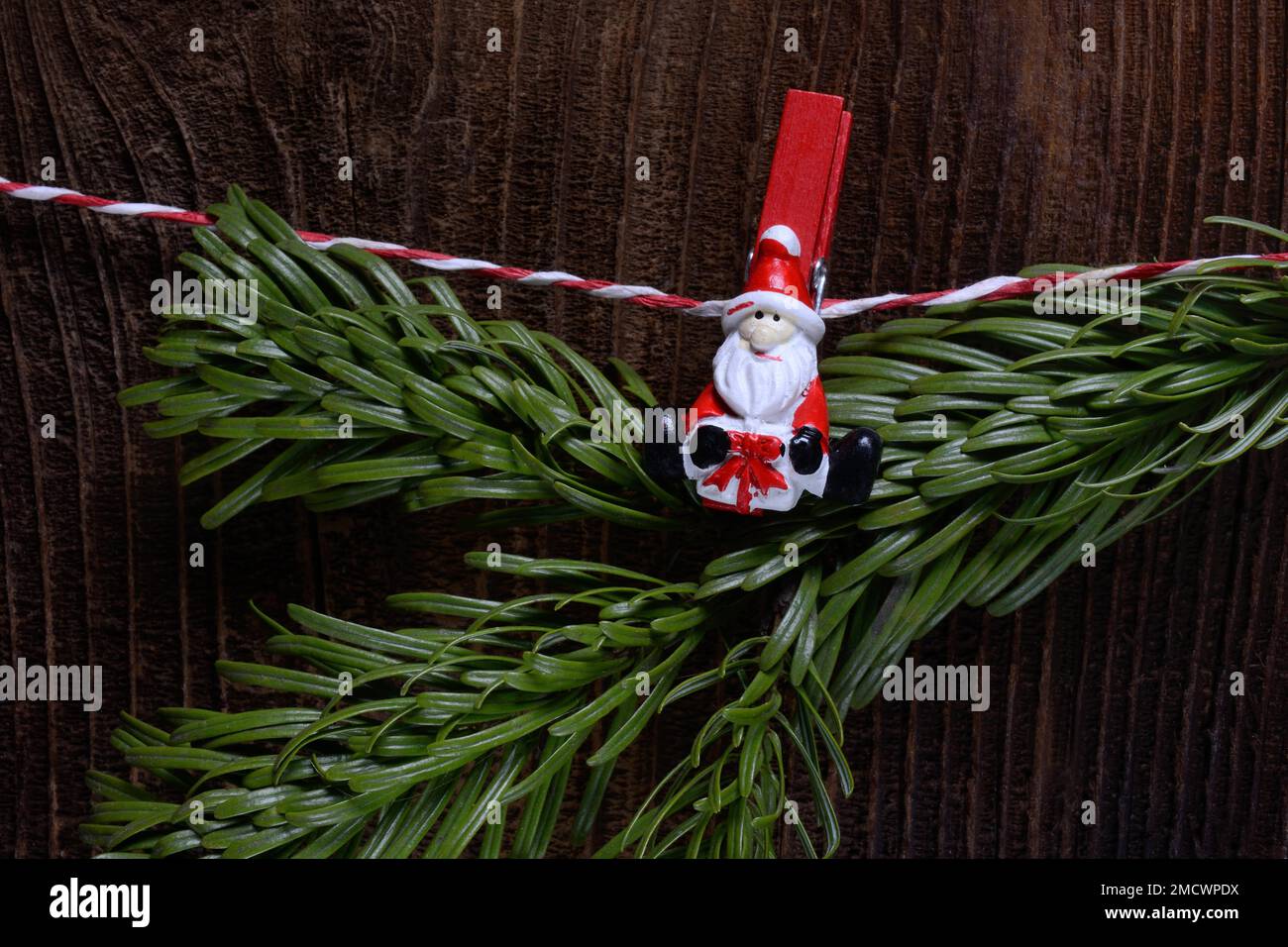 Clamp with Father Christmas holding fir greenery, Christmas Stock Photo ...