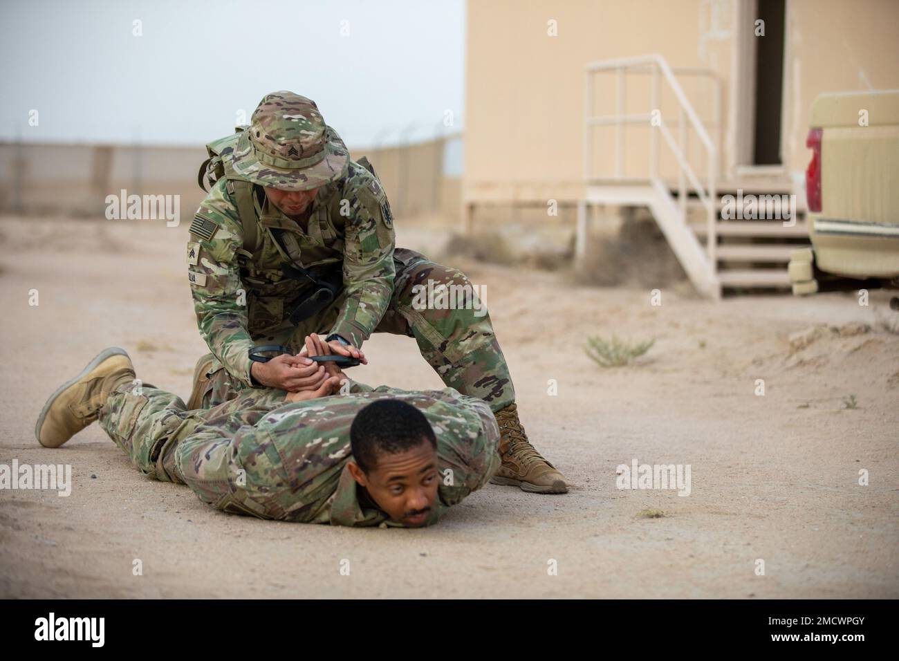 U.S. Army Sgt. Sergio Silva, top, with 90th Aviation Support Battalion ...
